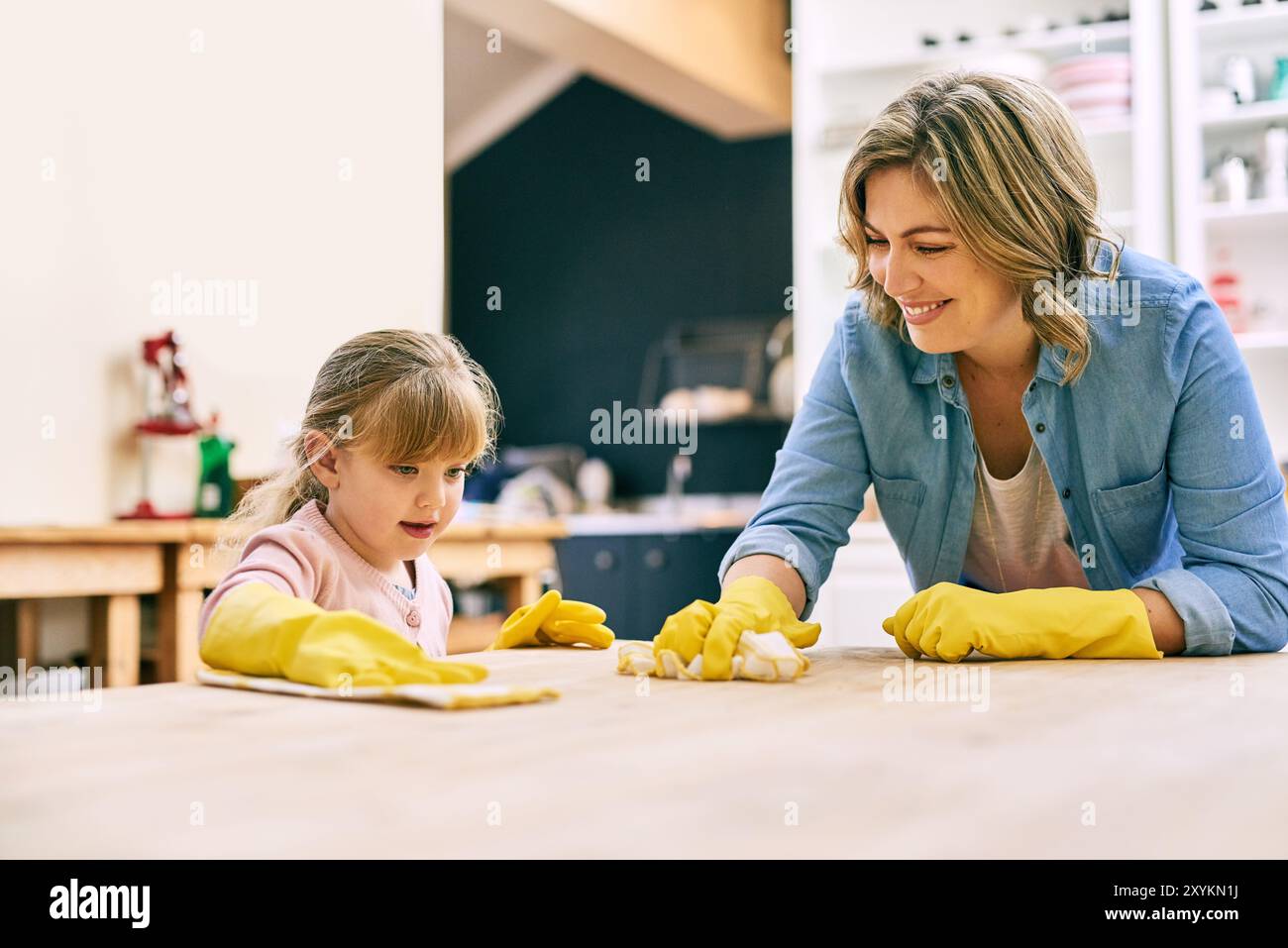 Cleaning, learning and mother with child for wipe counter in home for ...