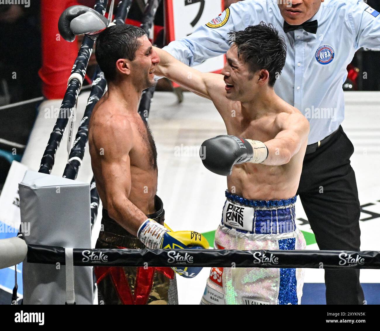 Japan's Seigo Yuri Akui, right, and Ukraine's Artem Dalakian hug after ...