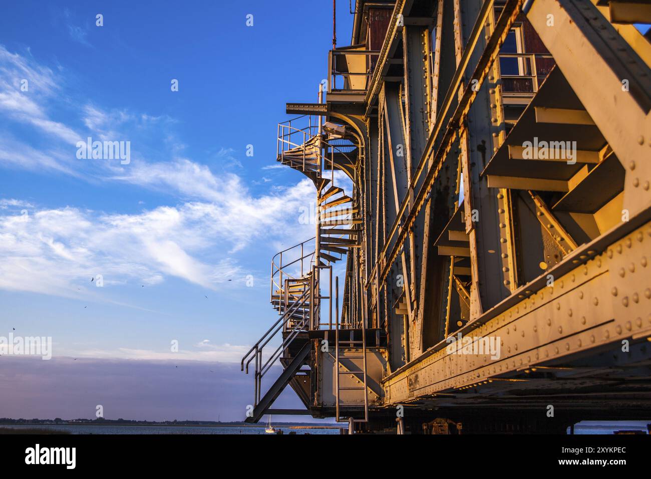 Spiral staircase on the side of a swing bridge Stock Photo - Alamy
