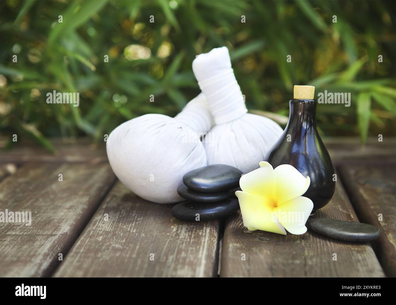 Spa theme objects with frangipani flower, compress balls, stacked ...