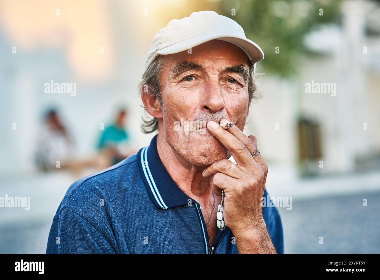 Elderly man, smoking cigarette and portrait on street for retirement ...