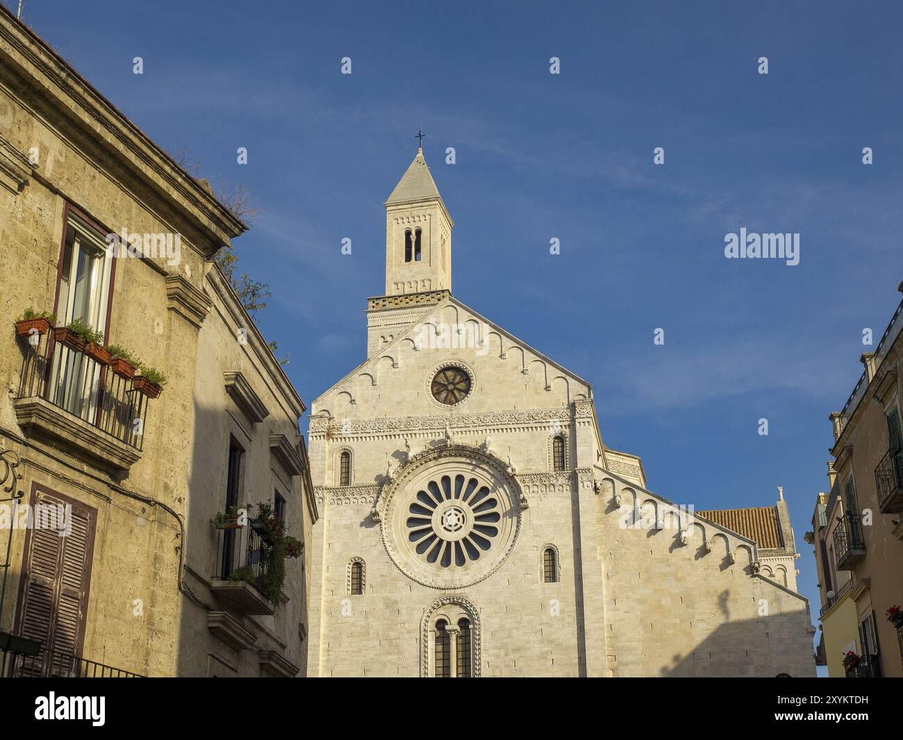 Gothic church and historic buildings in a city under a clear blue sky ...