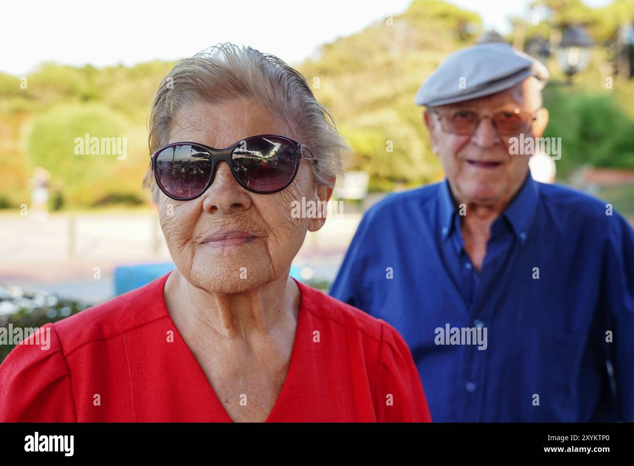 Happy older couple looking at camera outdoors. Active elderly Stock Photo - Alamy