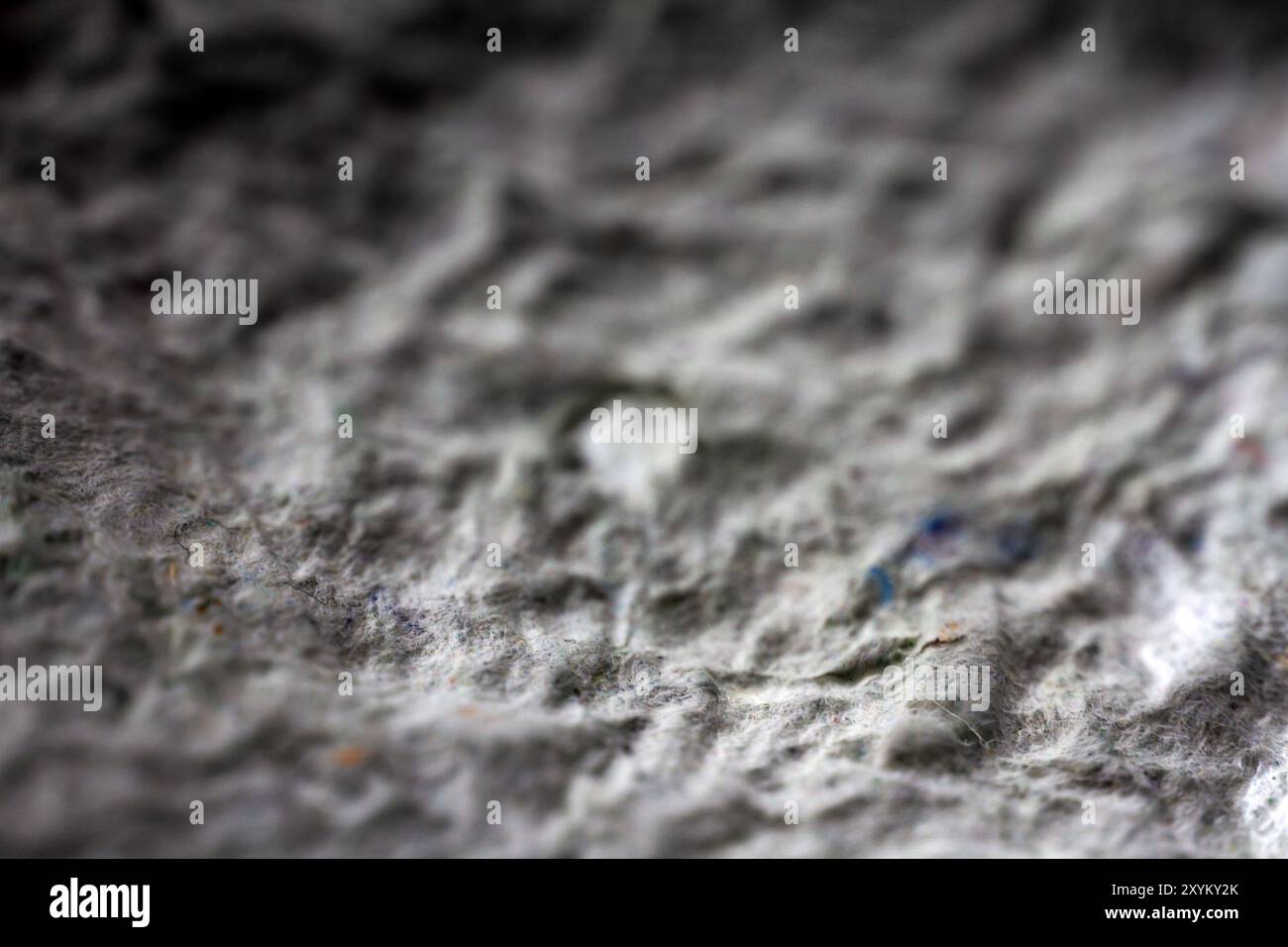 Extreme close up of old gray handmade paper clay with a structure and ...