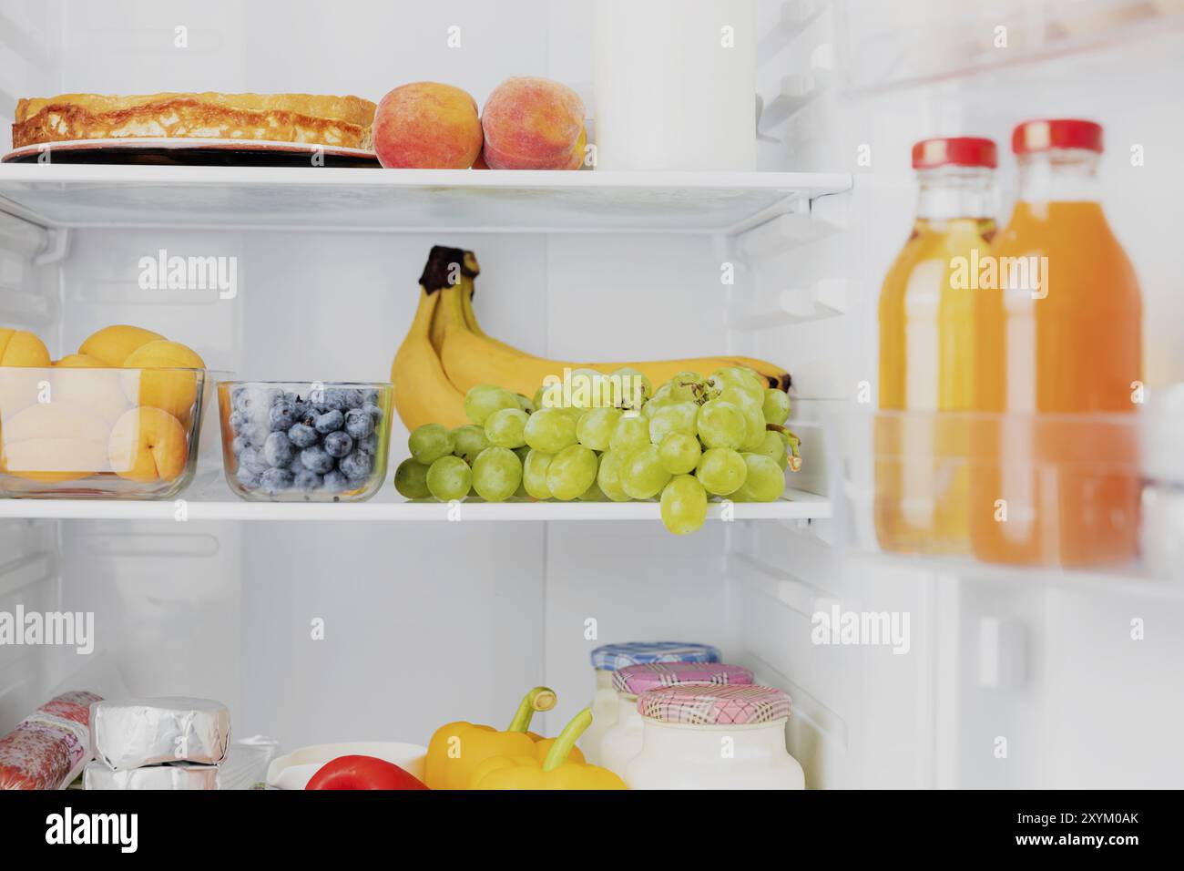 Front View of open two door fridge or refrigerator door filled with ...