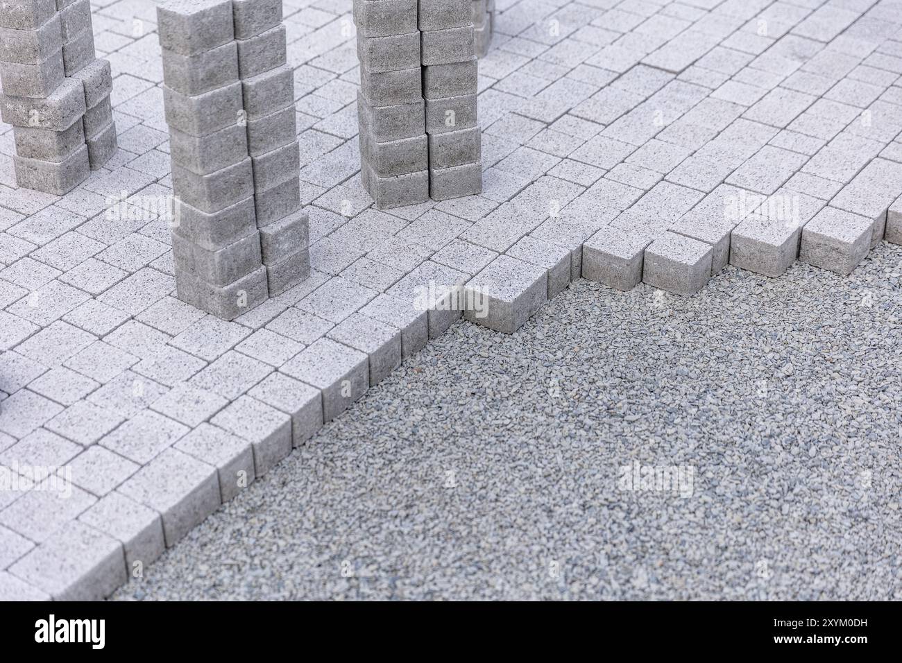 Close up of concrete blocks for new path way, building a new pavement ...