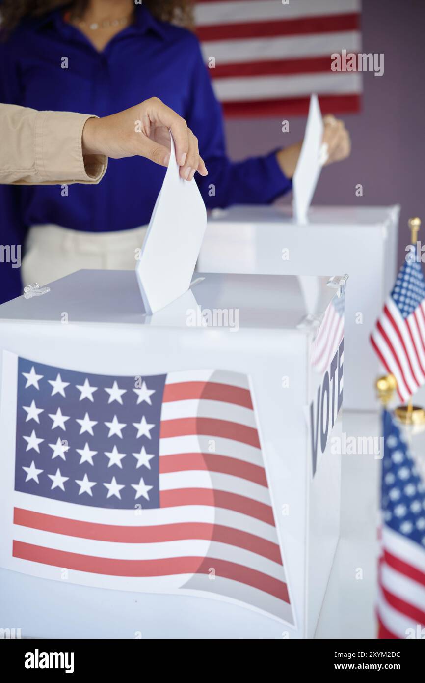 Woman putting vote paper hi-res stock photography and images - Alamy