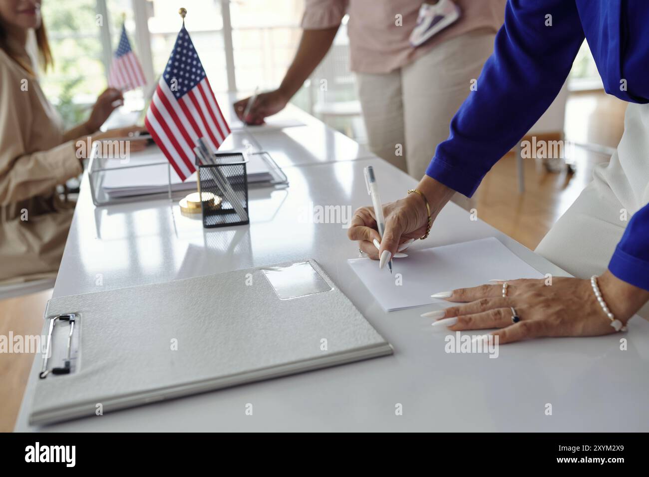 People Filling Documents And Voting Stock Photo - Alamy
