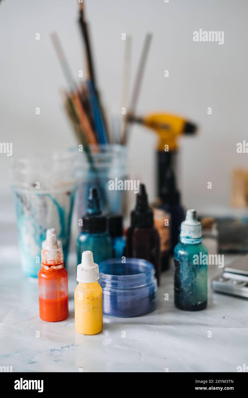 Creating vibrant epoxy resin art with various pigments and tools in a ...
