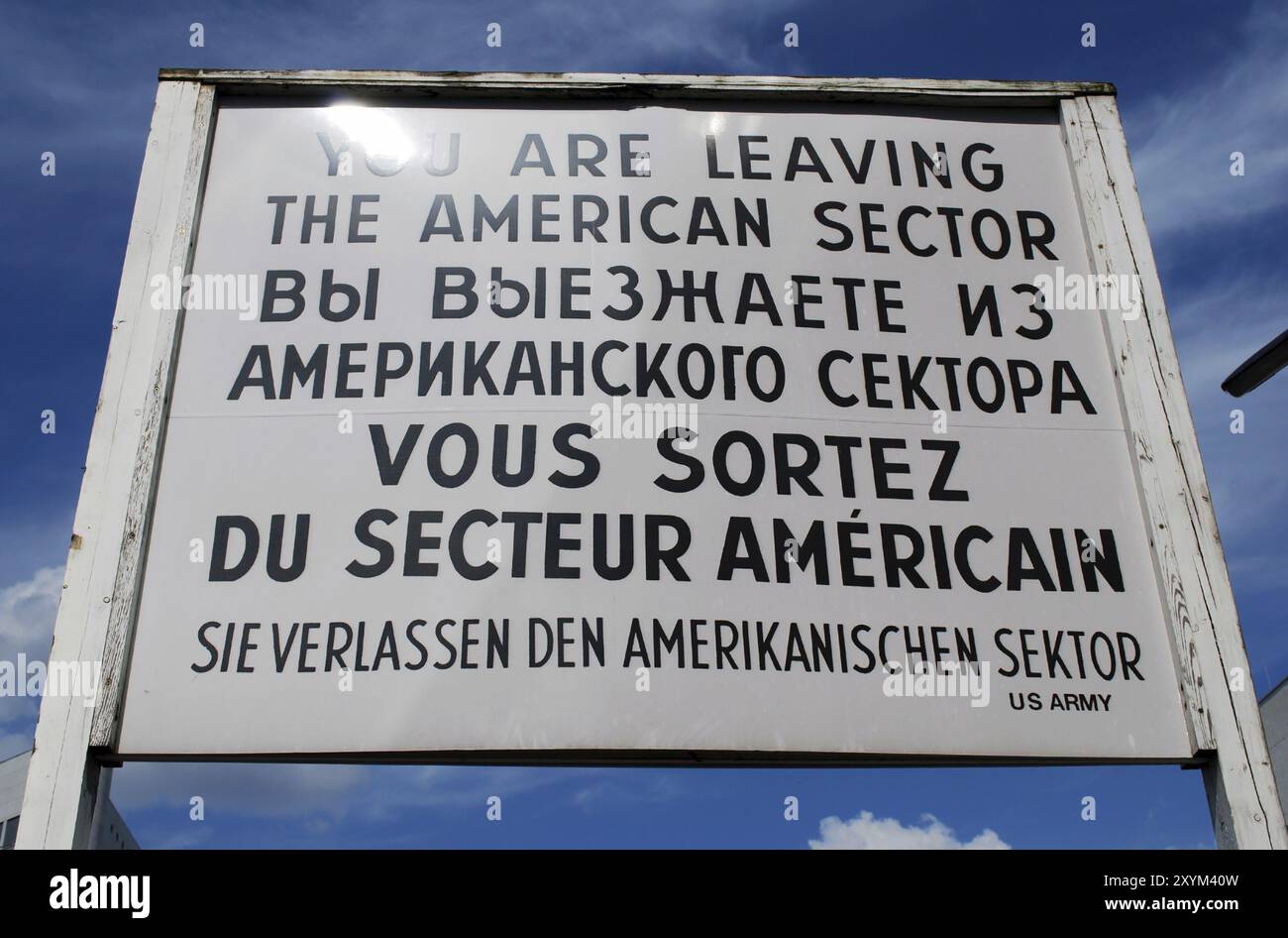 Berlin checkpoint charlie sign warnig to leave the american sector ...
