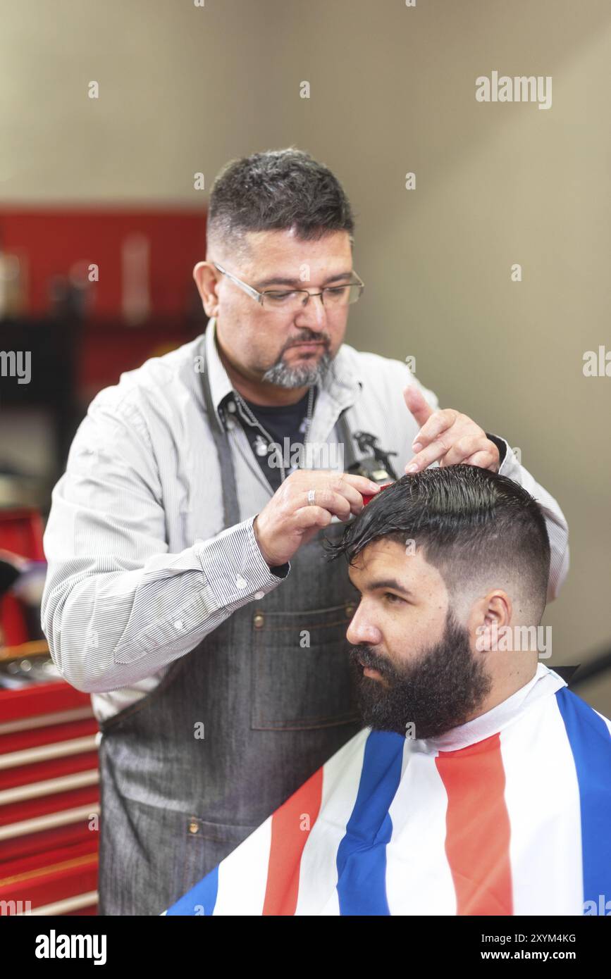 Barber cutting mens hair scissors hi-res stock photography and images ...