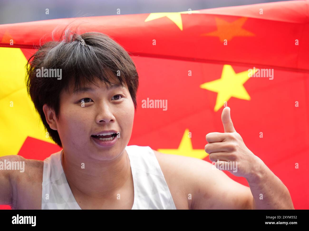 China's Xia Zhou celebrates winning the Women's 100m - T35 Final at the ...