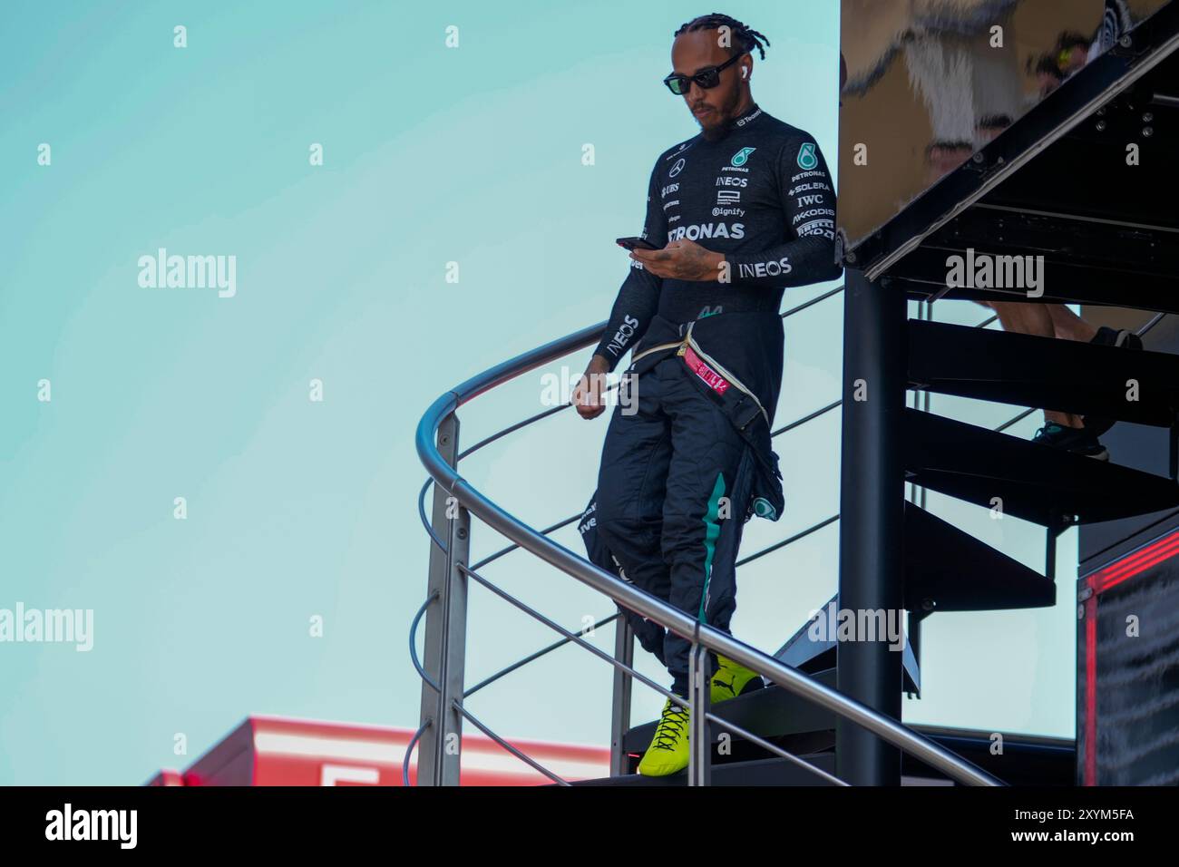 Mercedes driver Lewis Hamilton of Britain walks down stairs for the ...