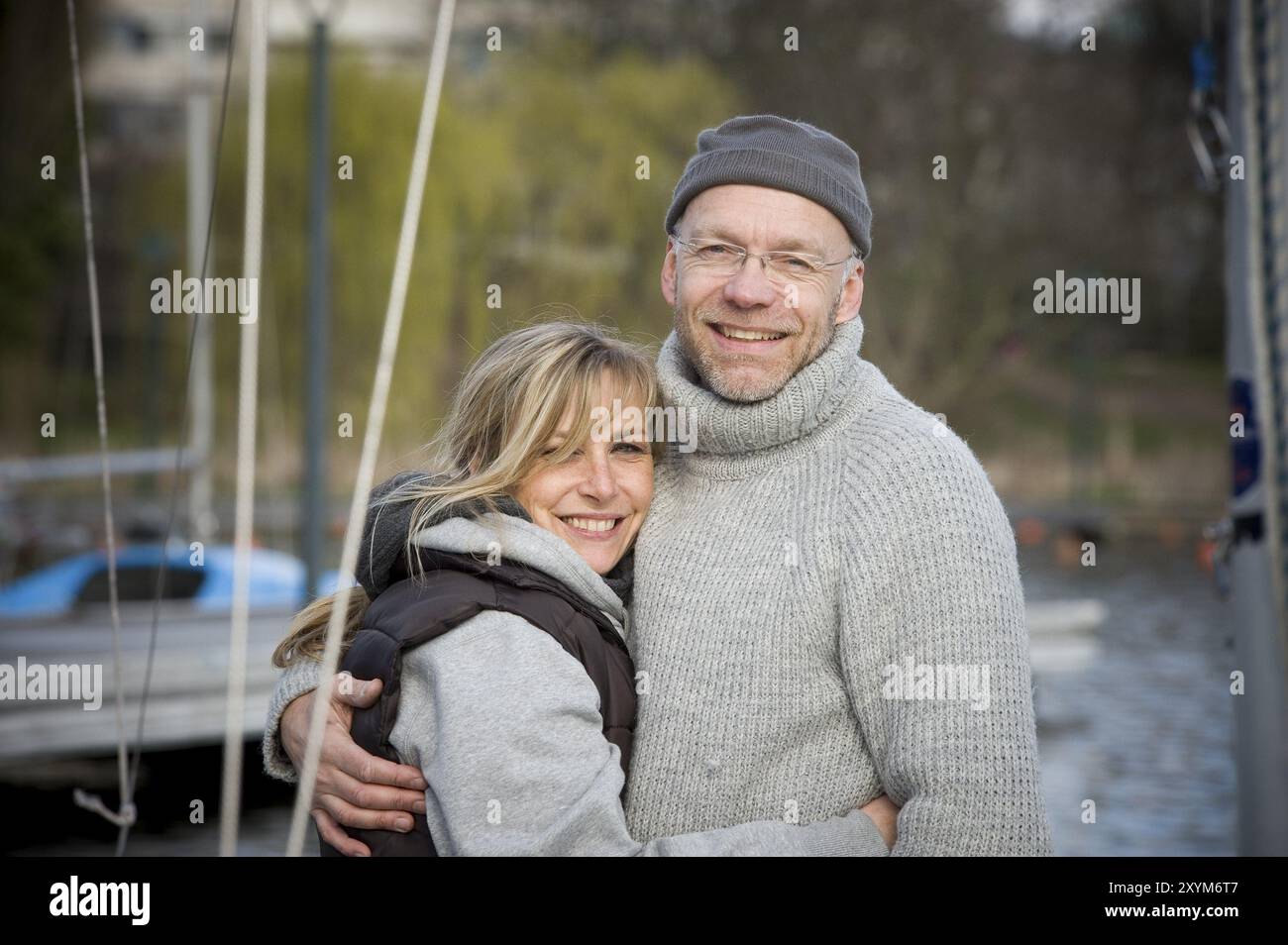 Happy couple hug each other on a sail boat Stock Photo - Alamy