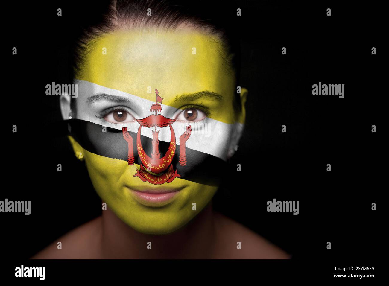 Portrait of a woman with the flag of the Brunei painted on her face ...