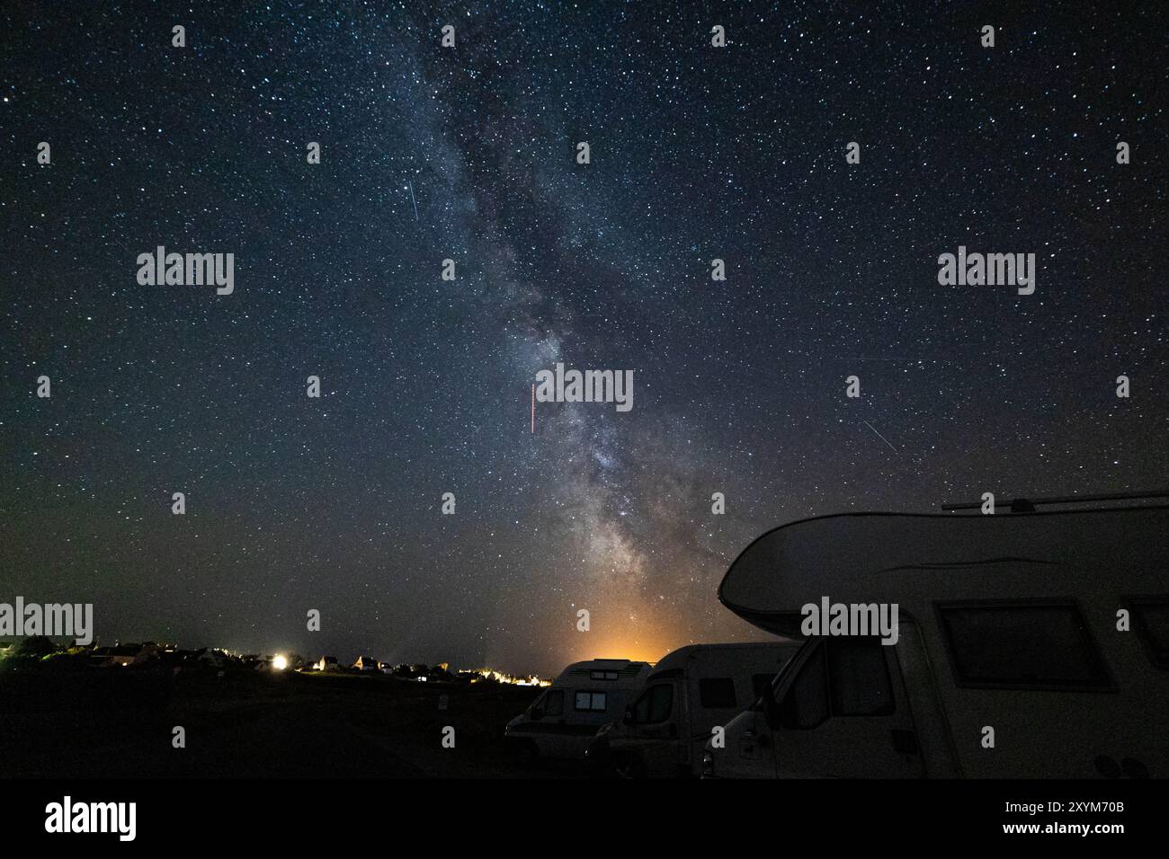 Night sky milky way core over overnight parked vans Stock Photo - Alamy