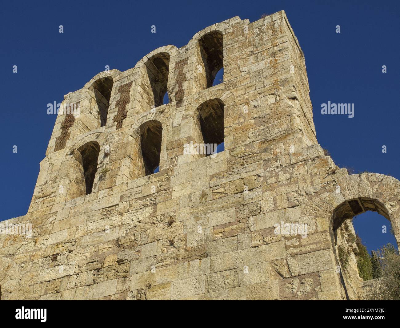 Old tower with several arches, bright blue sky and sunshine, athens ...
