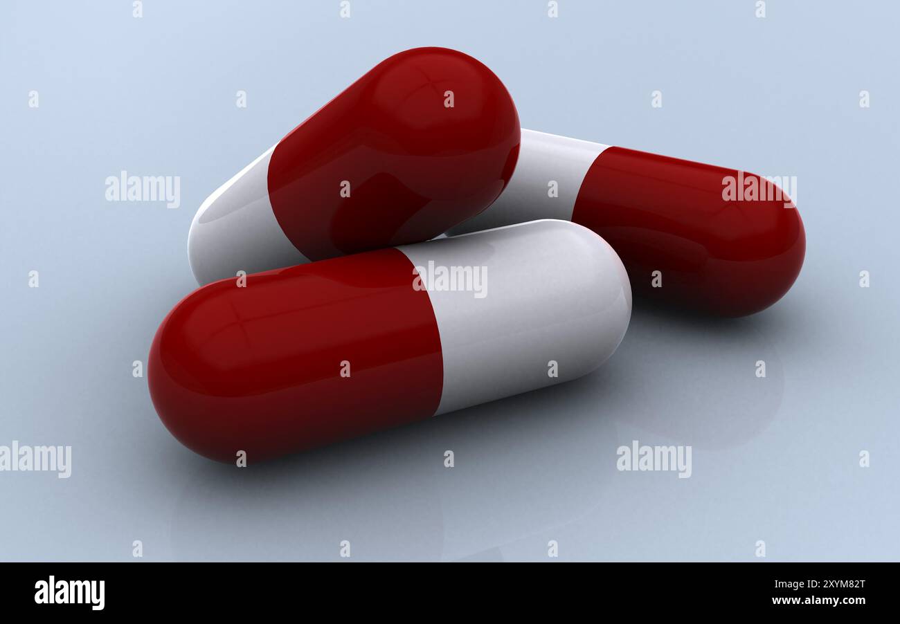 Red and yellow medication capsules on colored background Stock Photo ...