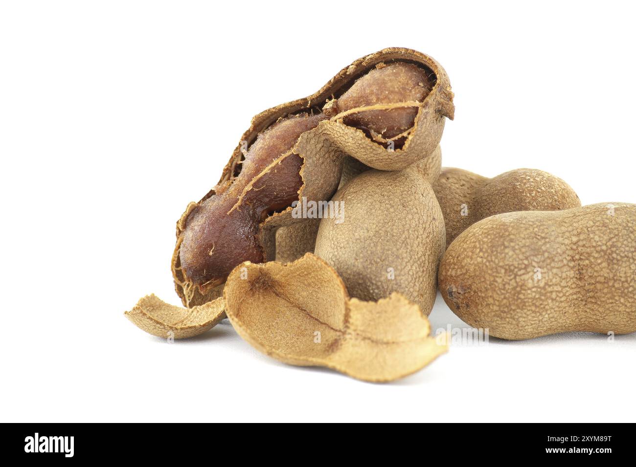 Tamarind fruits, whole and cracked open isolated on white background ...