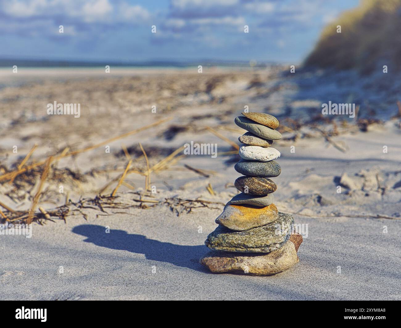 Stone pyramid on the beach at Zingst. Stones stacked on top of each ...