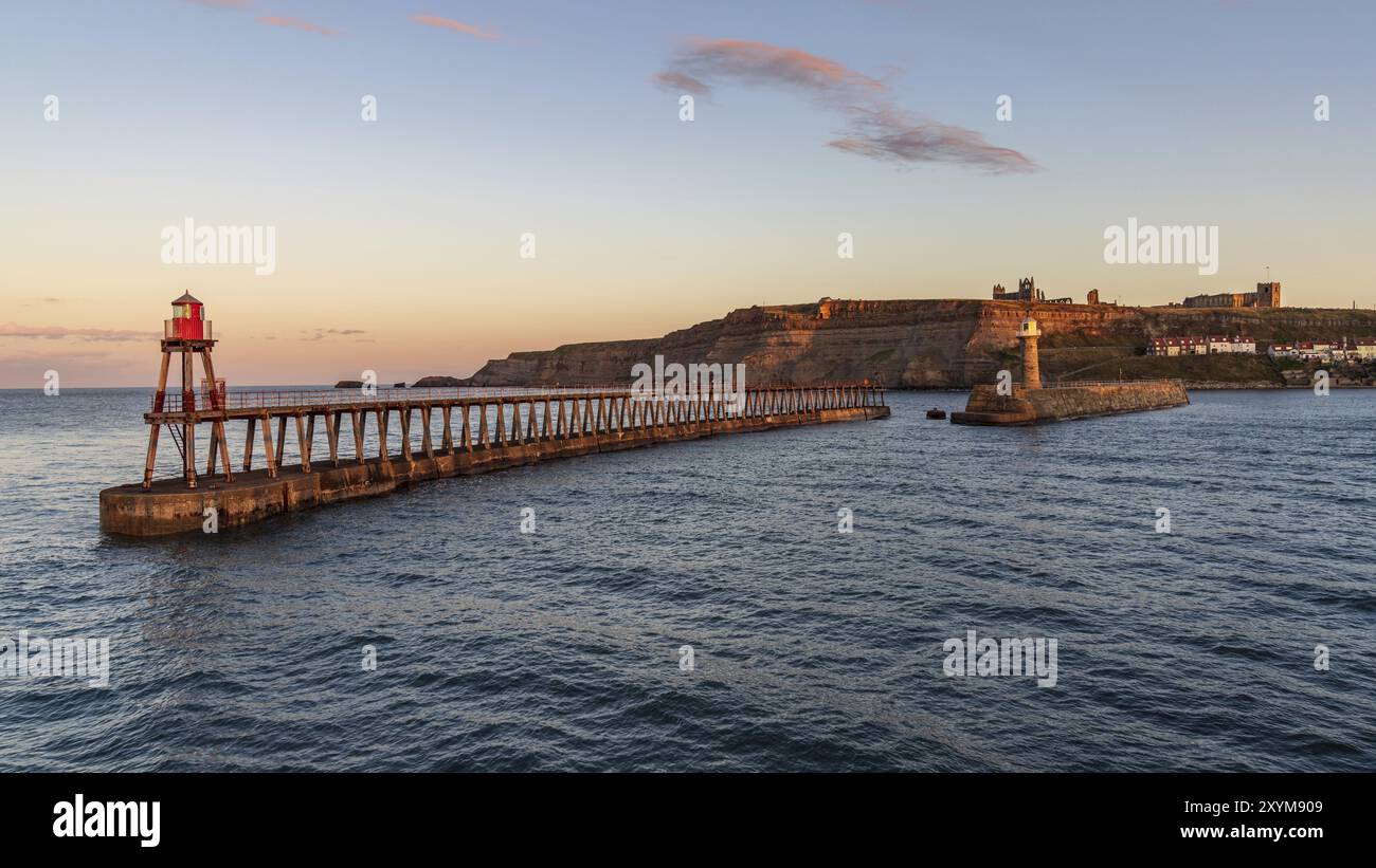 Whitby, North Yorkshire, England, UK, with the East Pier Lighthouse ...