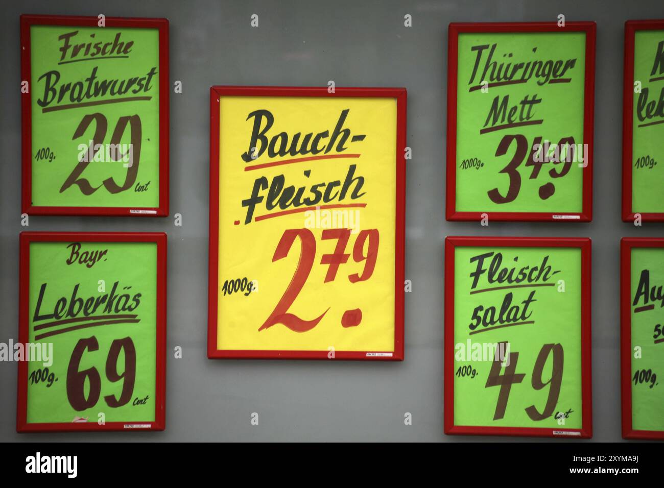 Posters in the window of a butcher's shop Stock Photo - Alamy