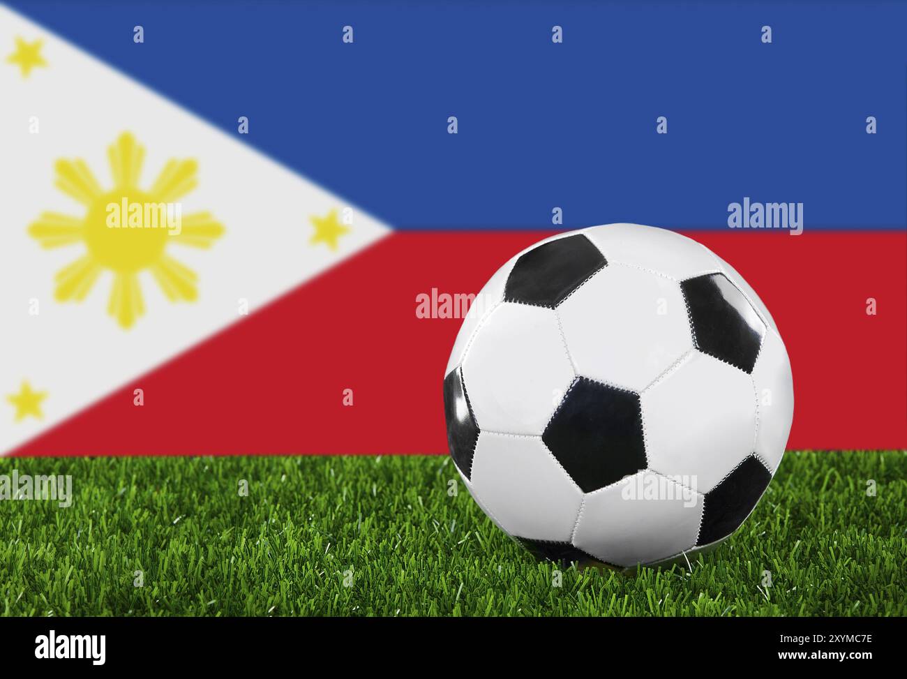 The Philippines flag and soccer ball on the green grass Stock Photo - Alamy