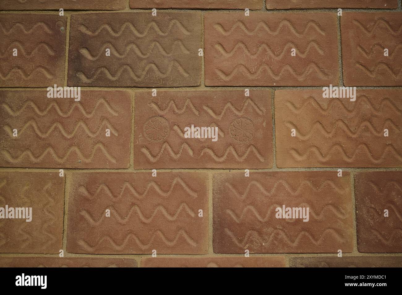 Terracotta wall tiles with a repeating zigzag pattern in traditional ...