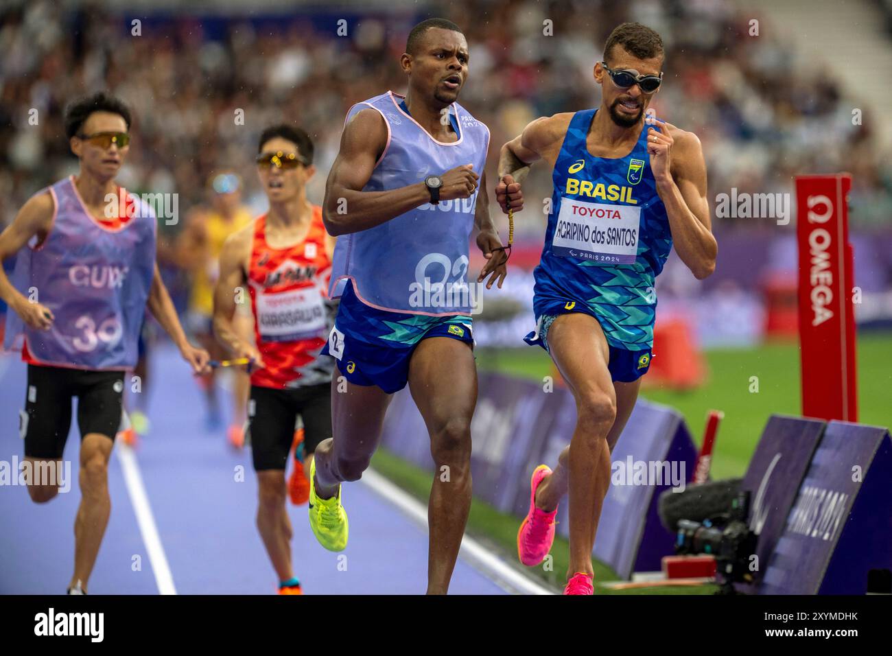 Brazil's Julio Cesar Agripino dos Santo, right, leads the race at Men's 5000m - T11 final at the ...