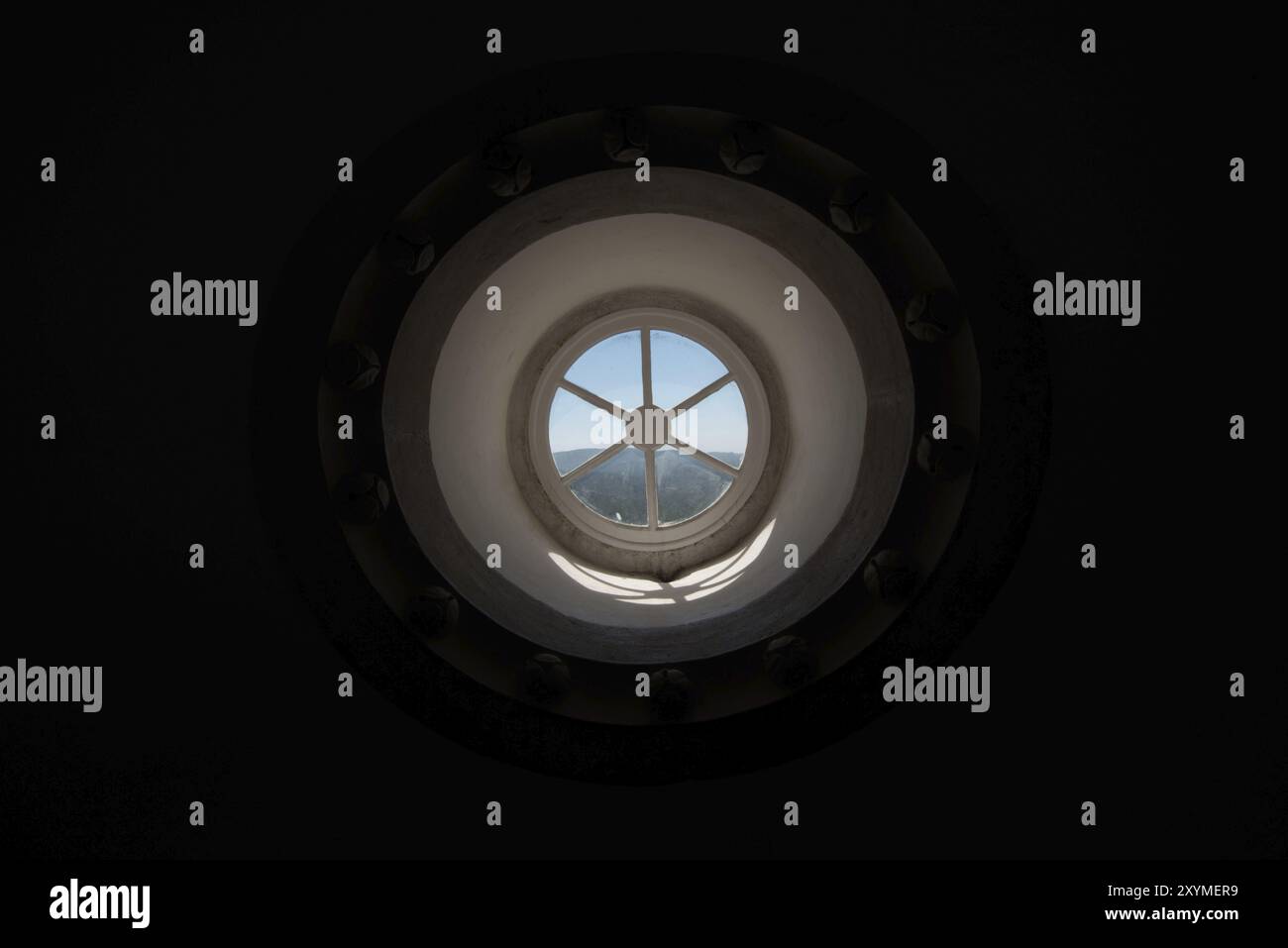 Round window sunny landscape outside, black interior Stock Photo - Alamy
