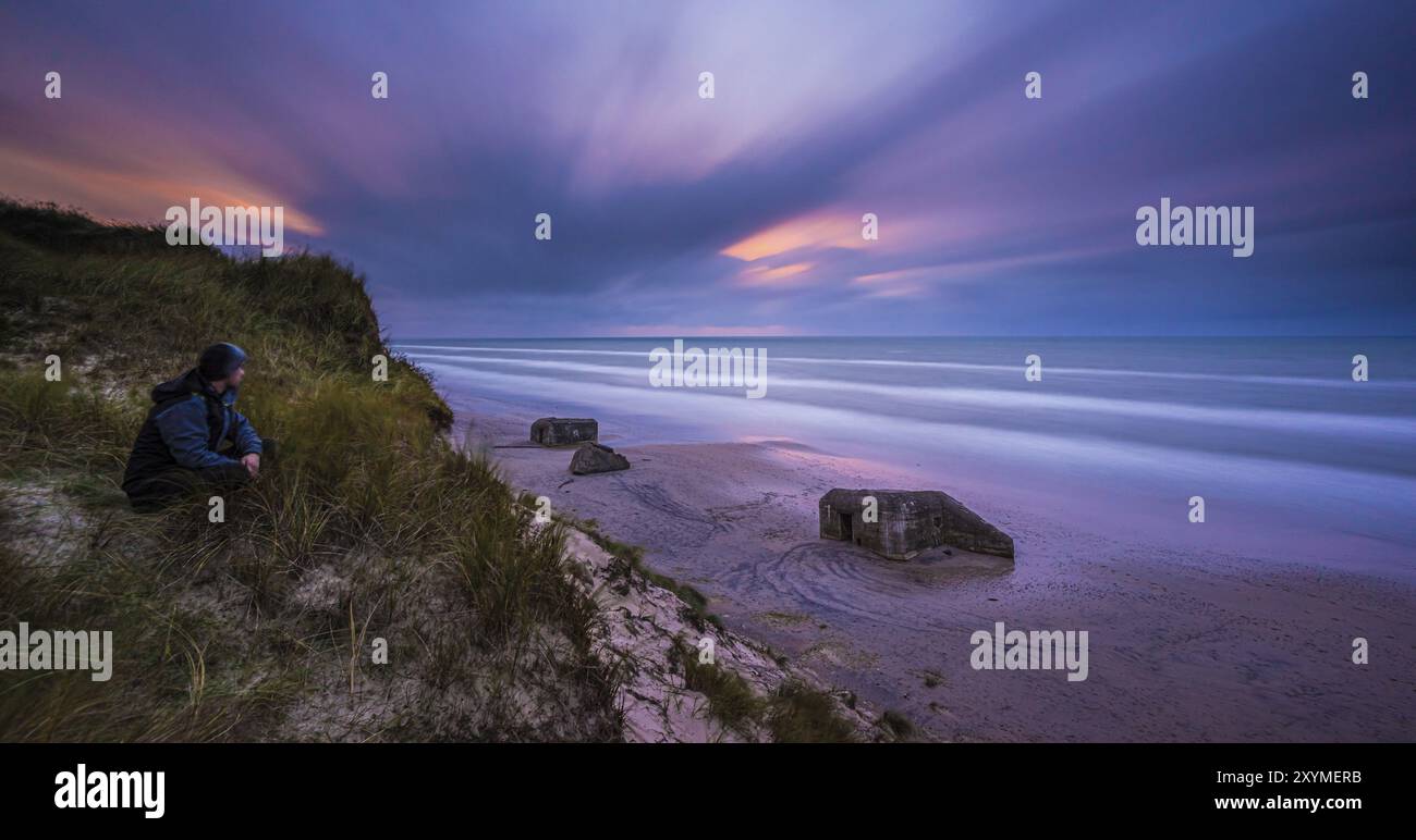 Long exposure of old bunker fortifications on a sandy beach Stock Photo ...