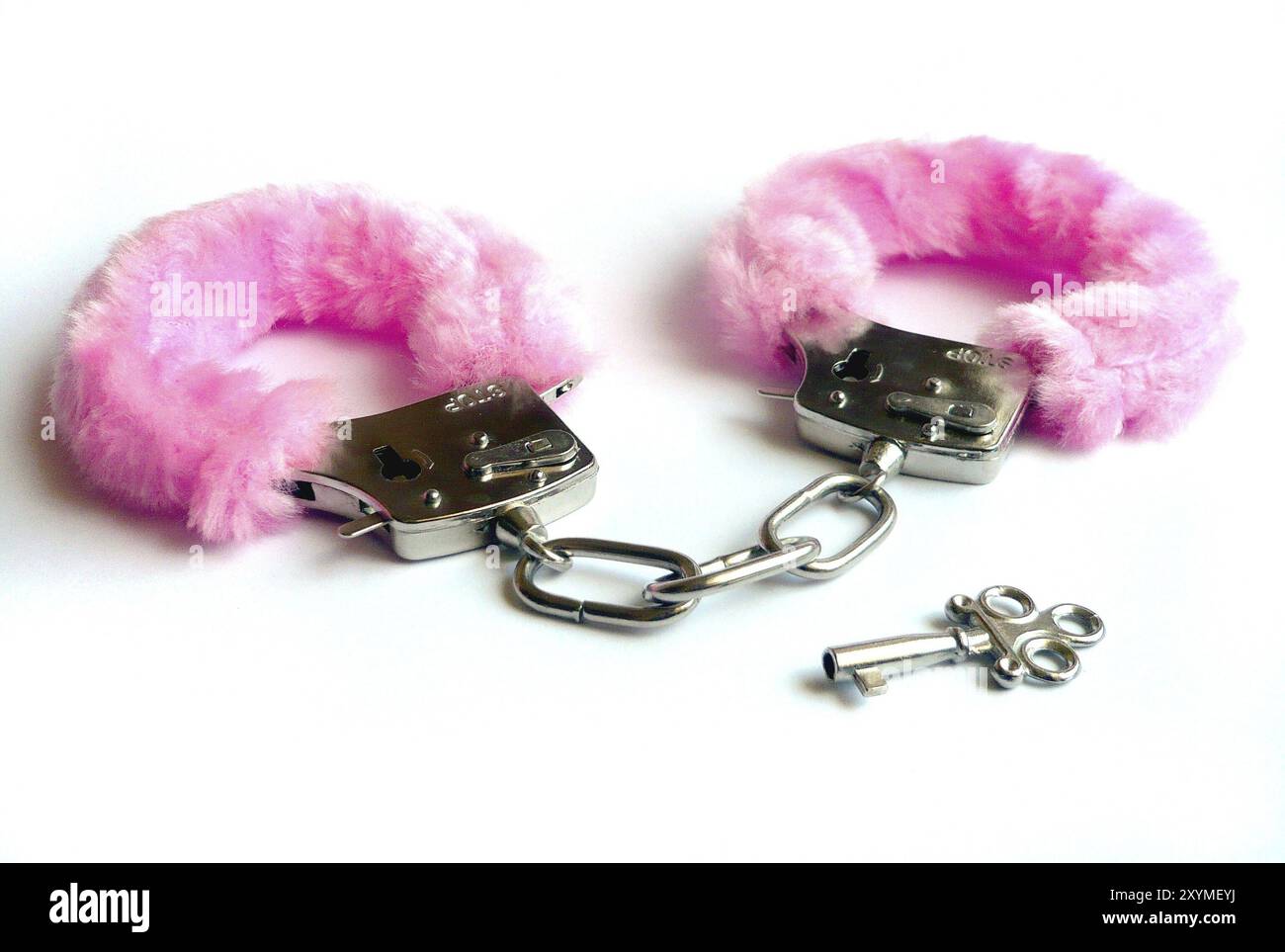 Pink handcuffs hi-res stock photography and images - Alamy
