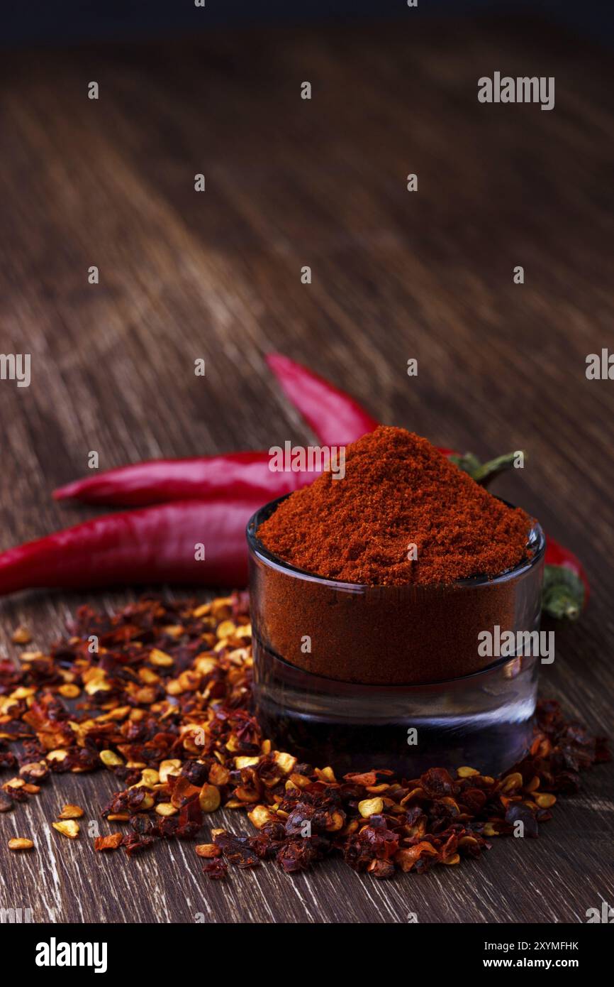 Chili peppers on rustic background, fresh, seeds and powder Stock Photo ...