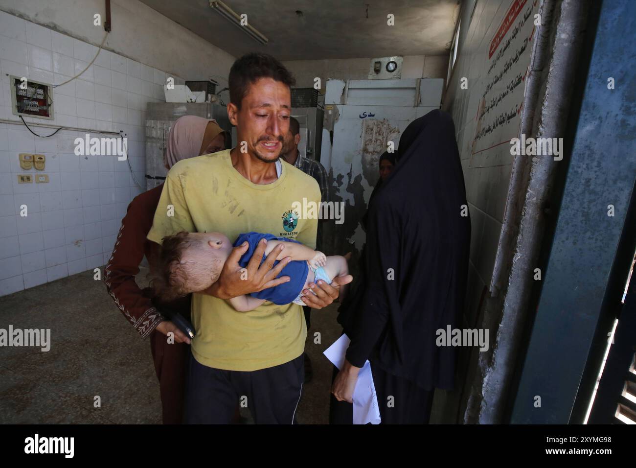 Relatives of the Palestinian child Amir Al-Adawi, 1 year old, mourn him ...