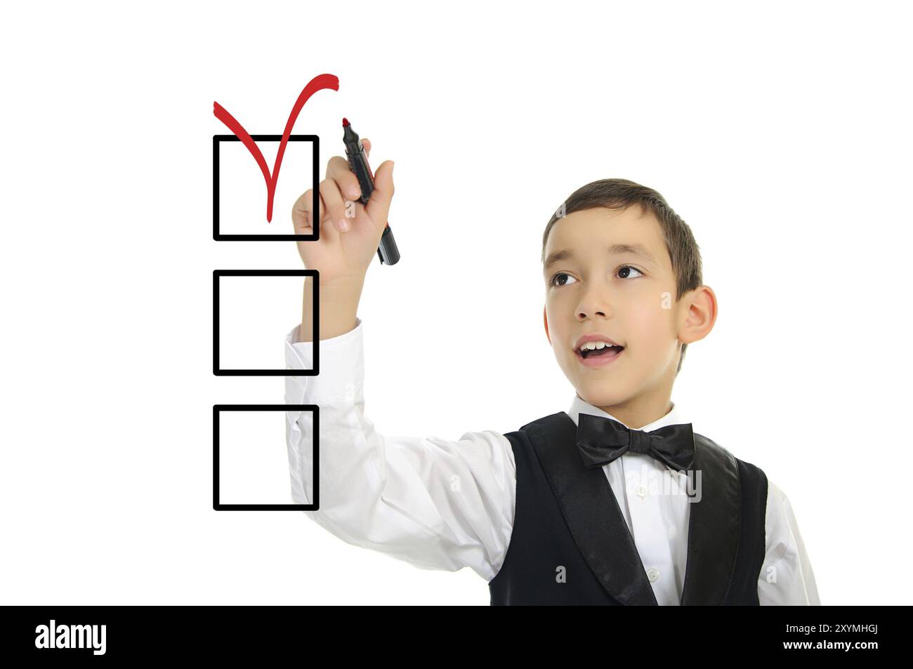Portrait of a young school boy wrighting or drawing checkboxes with ...