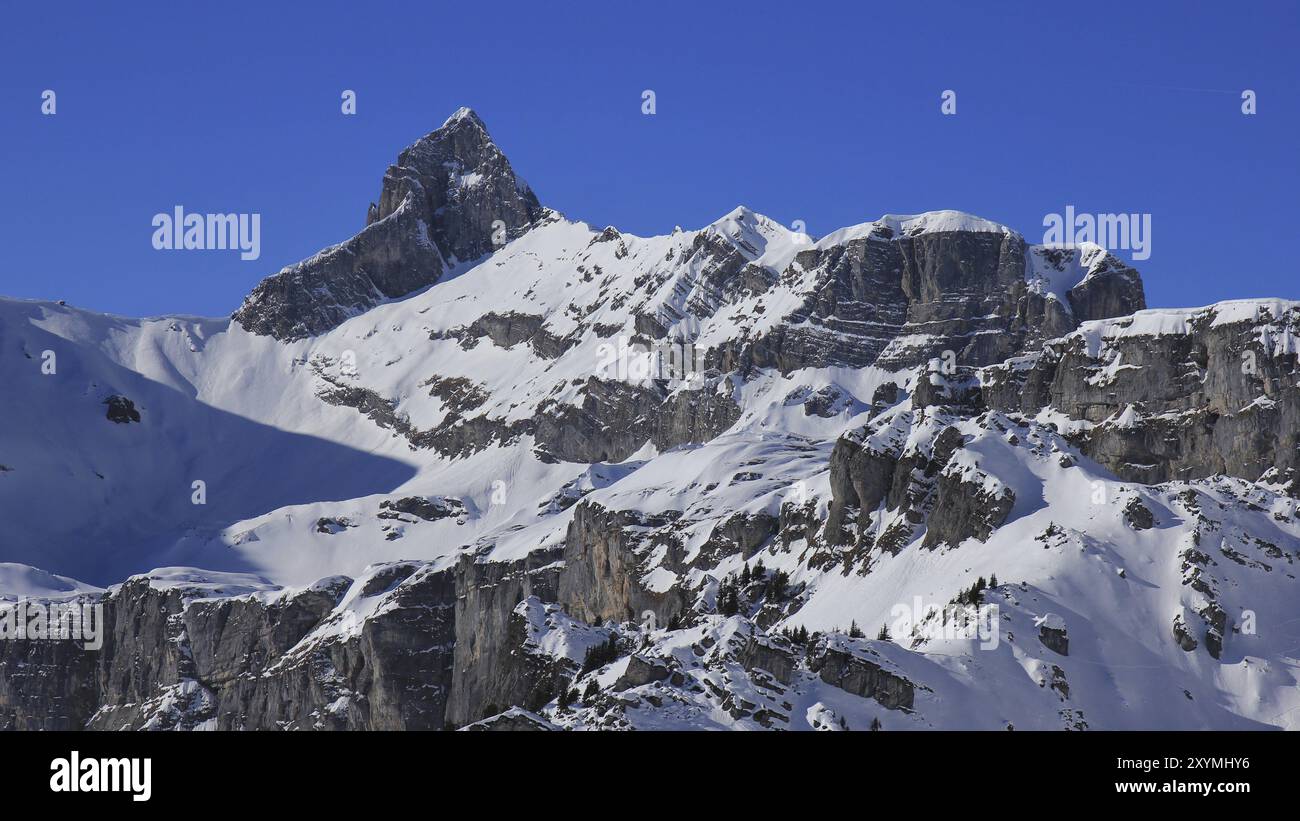 Winter scene in the Swiss Alps. Hoch Turm, mountain peak in Braunwald ...