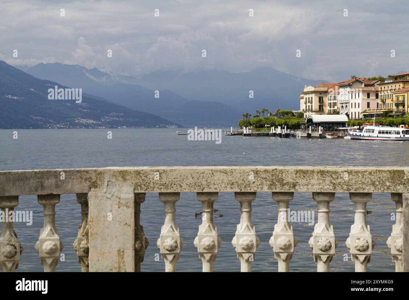 Stone balustrade on Lake Como with a view of Belaggio Stock Photo - Alamy