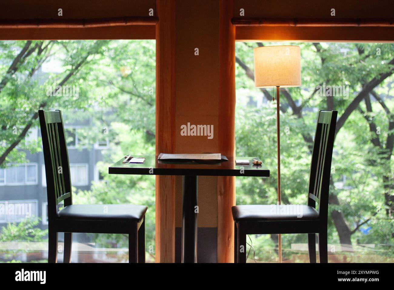 Japanese Dining Table with Two Chairs by a Window Overlooking Urban ...