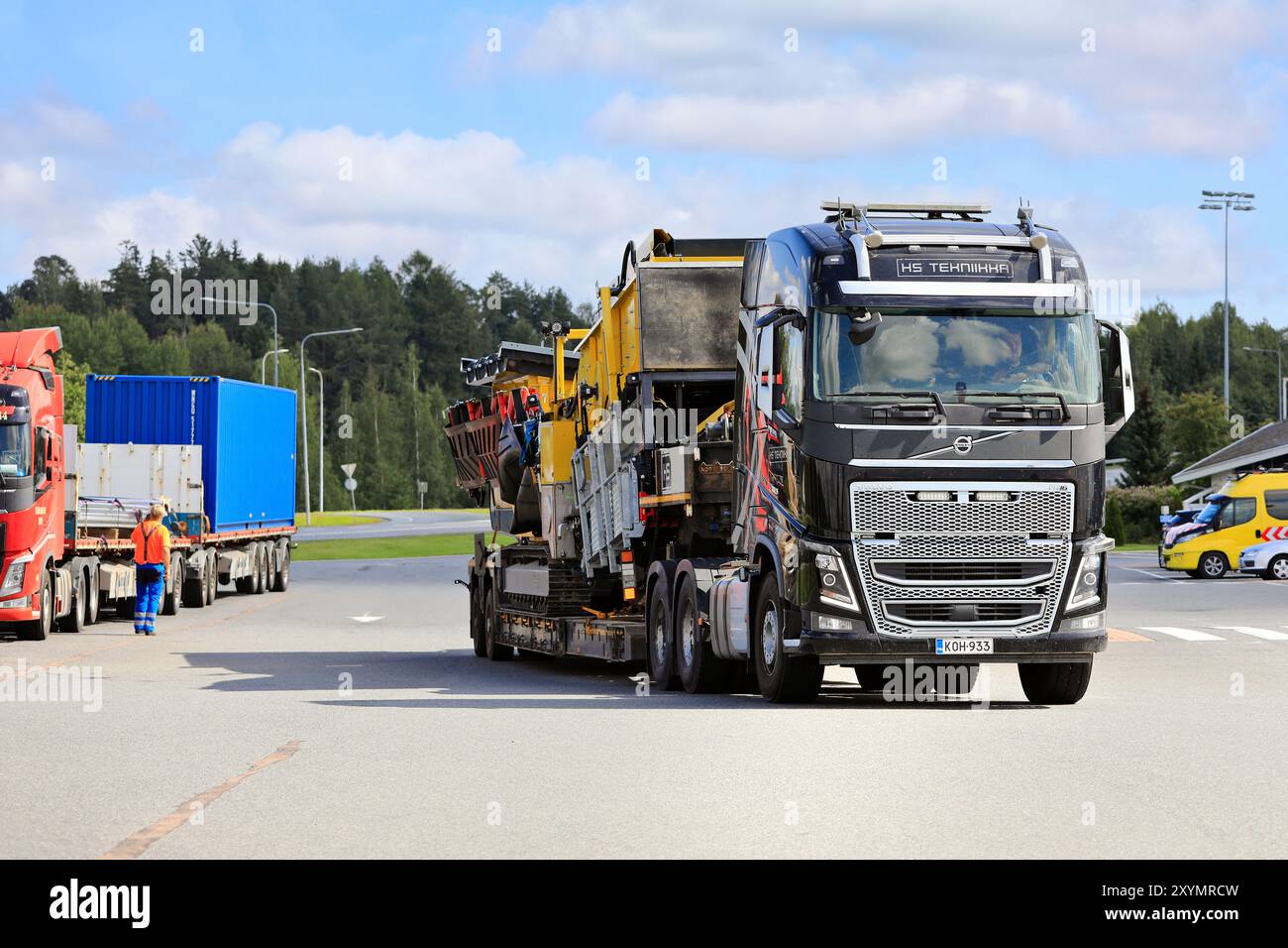 Black Volvo FH16 truck low loader trailer begins oversize load ...