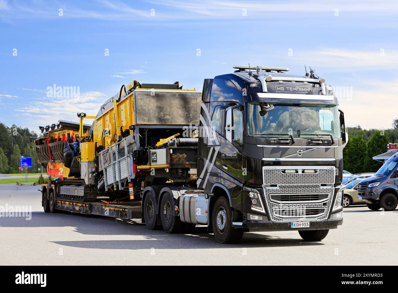 Black Volvo FH16 truck pulls oversize load of a Keestrack C6 mobile ...