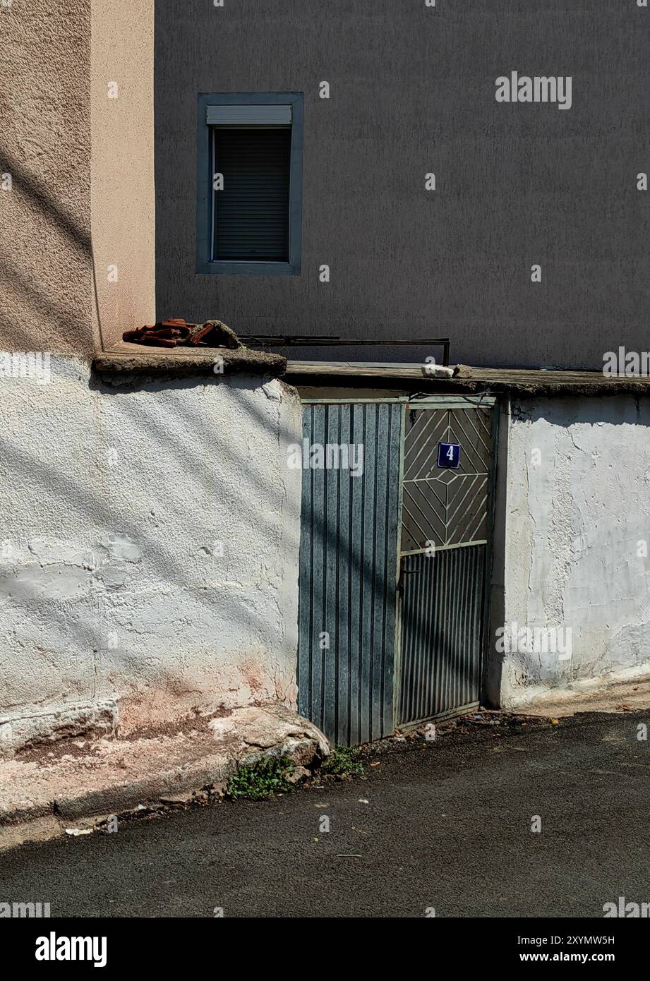 In the Shadows and light.: Metal Door Frame with number four, with blue ...