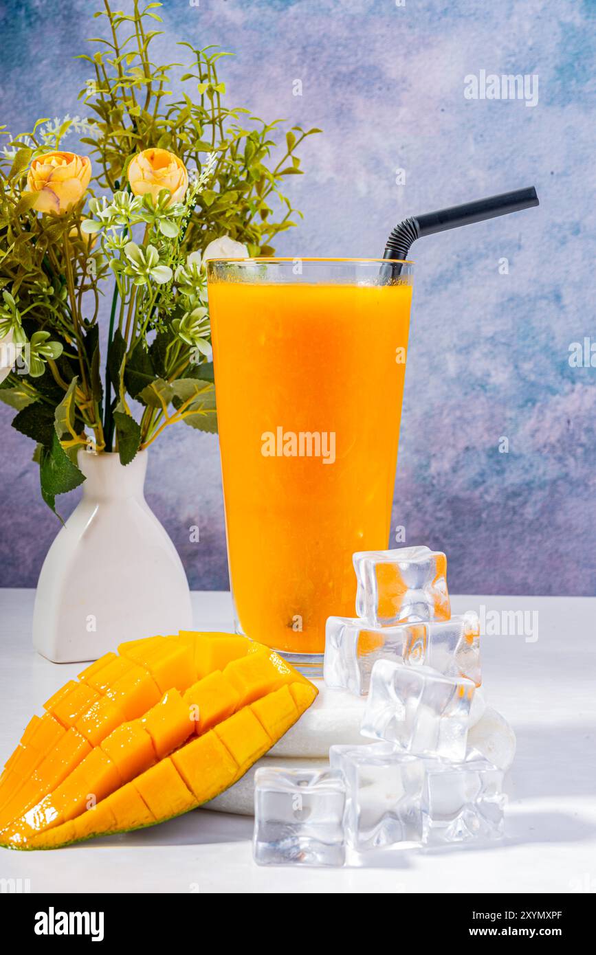 Refreshing Mango Smoothie with Whipped Cream and Ice Cubes Stock Photo - Alamy