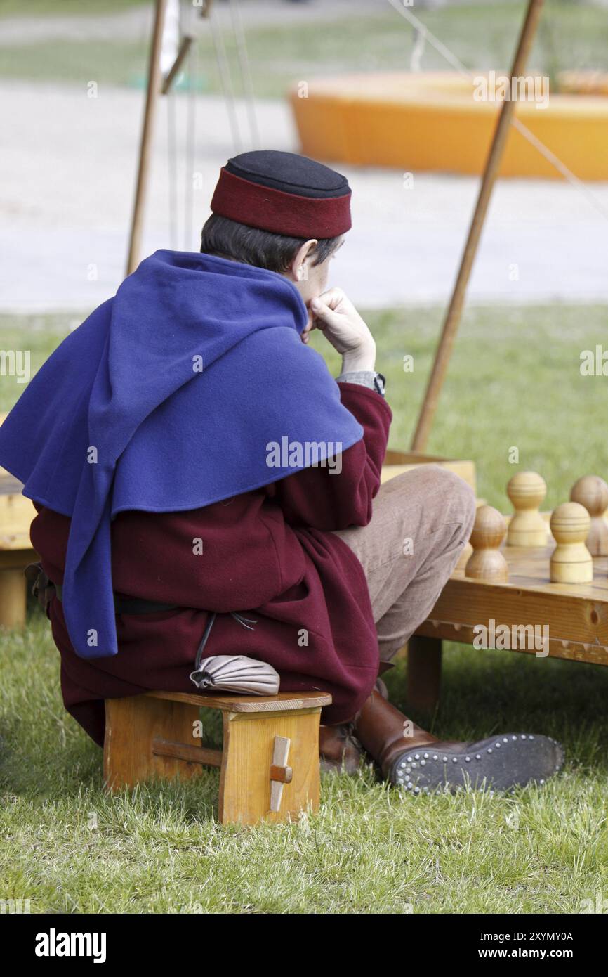 Board gamers at a medieval market Stock Photo - Alamy