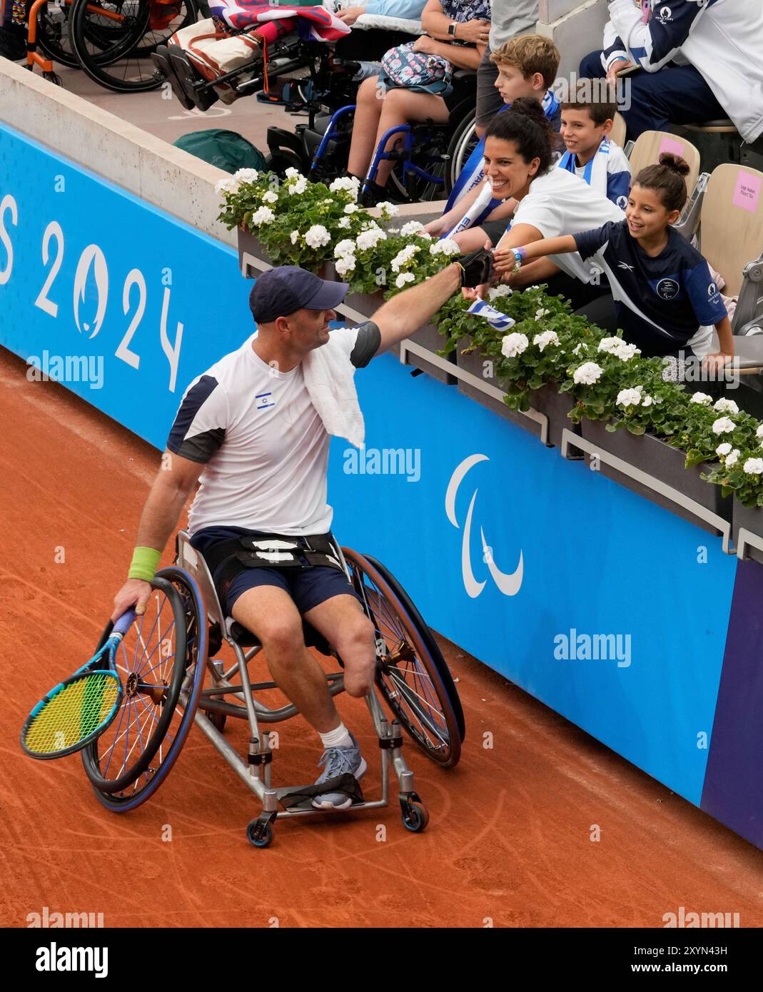 Israel's Adam Berdichevsky shakes hands with his wife Hila and his ...