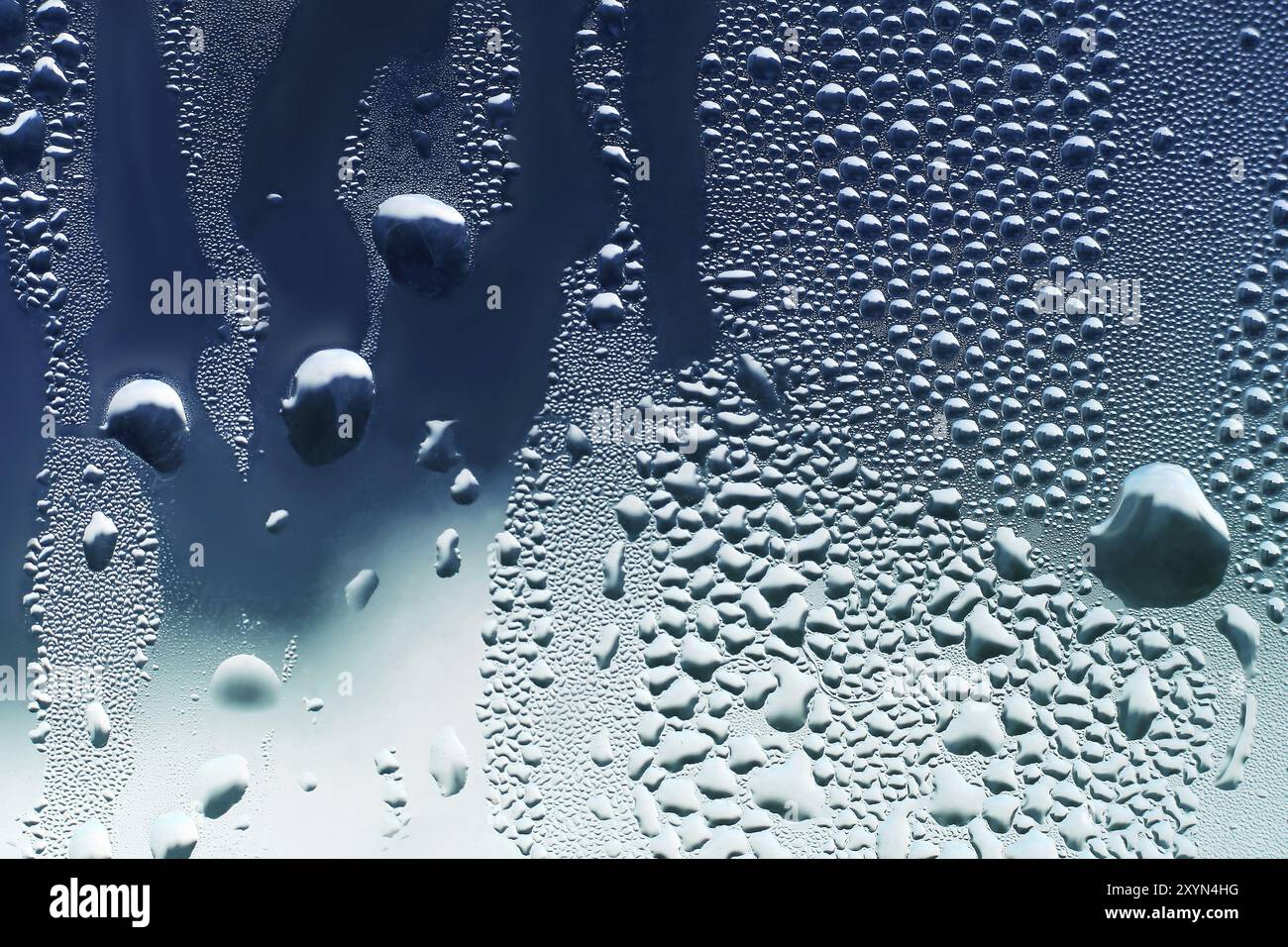 Large and fine water drops on window glass Stock Photo - Alamy