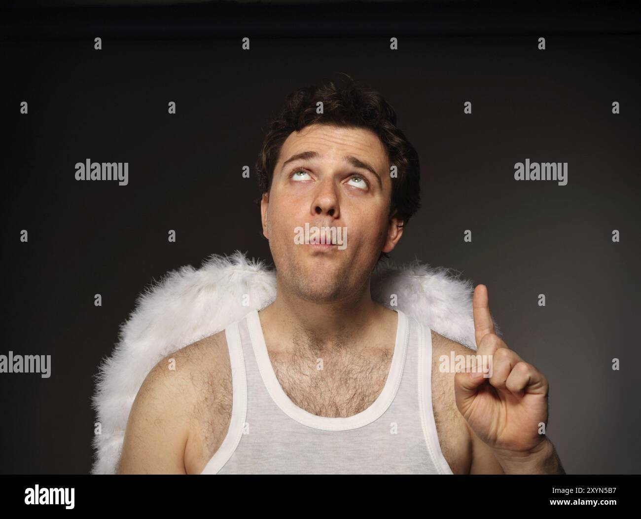 Mr. Angel with white wings. Creepy character portrait Stock Photo - Alamy