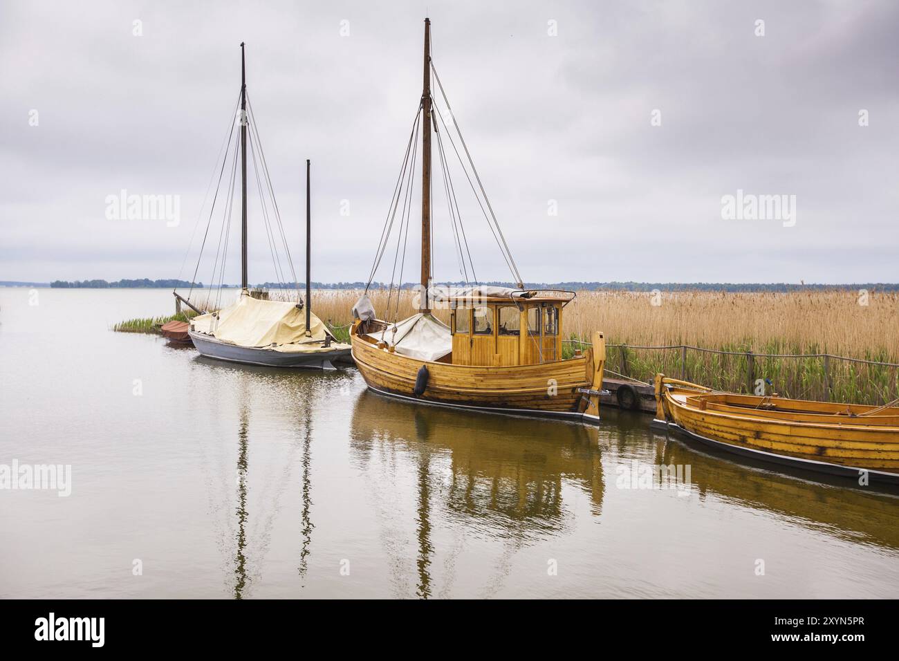 Vintage style boats in a small harbour Stock Photo - Alamy