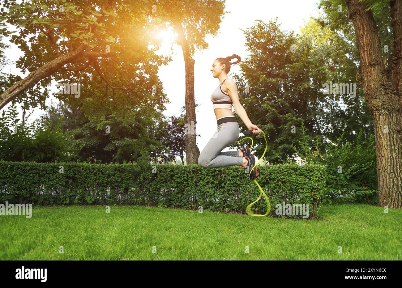 Slim woman training skipping rope hi-res stock photography and images ...