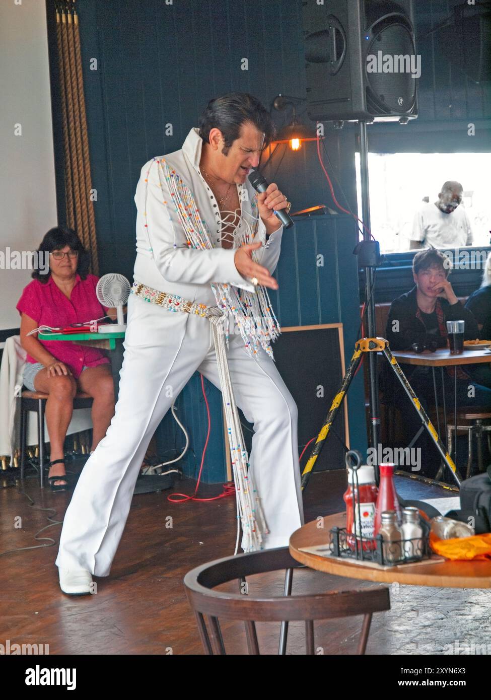 An Elvis tribute act at a Brighton pub Stock Photo - Alamy