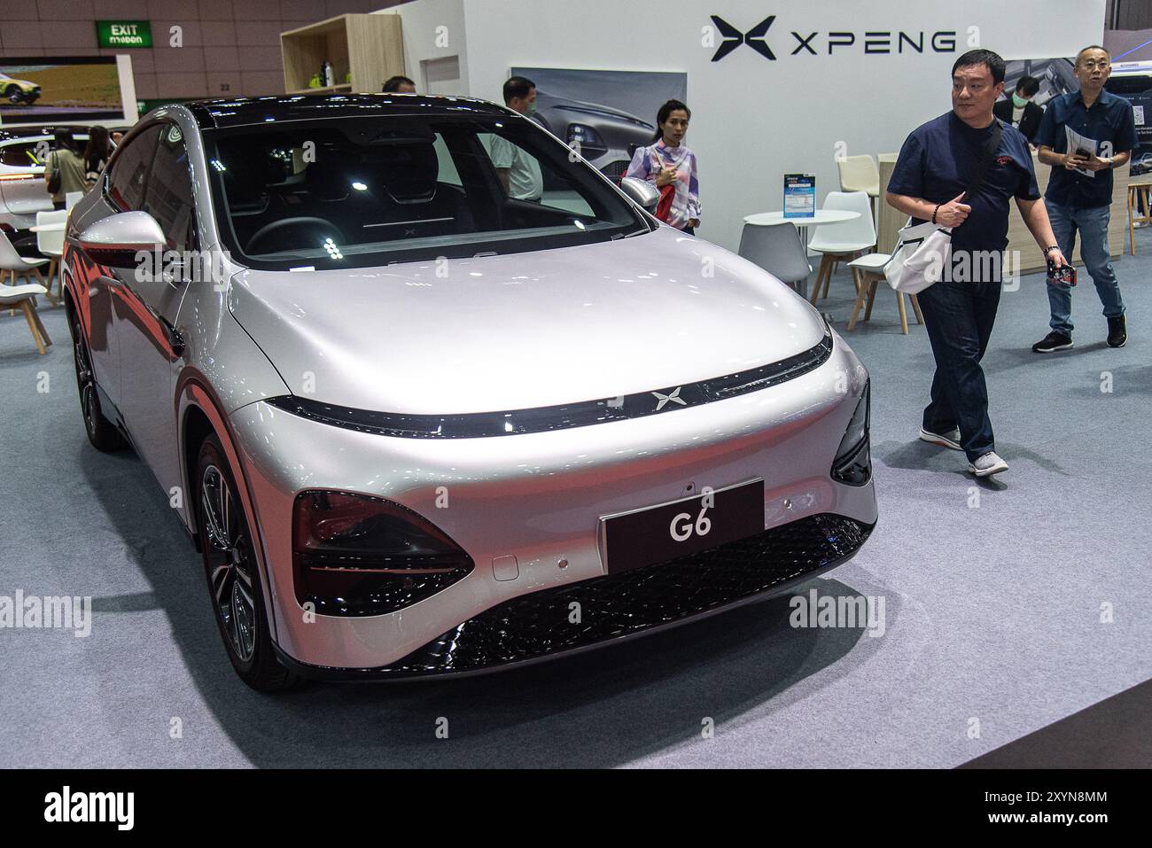 Visitors inspect a Xpeng G6 car during the Thailand Big Motor Sale 2024 ...
